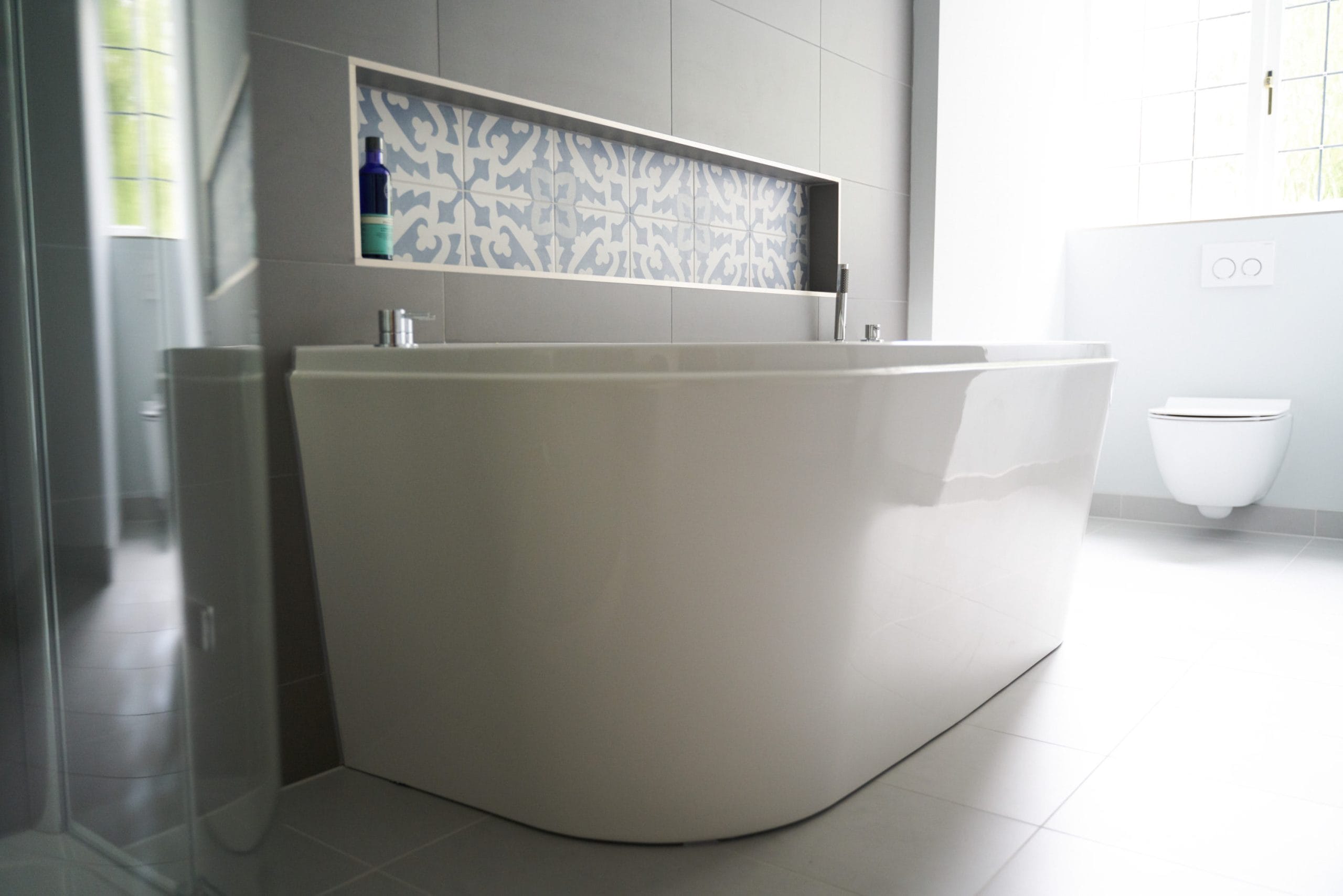 Family Bathroom Design with Back to Wall Curved Bath and Patterned Tile Details | The Brighton ...